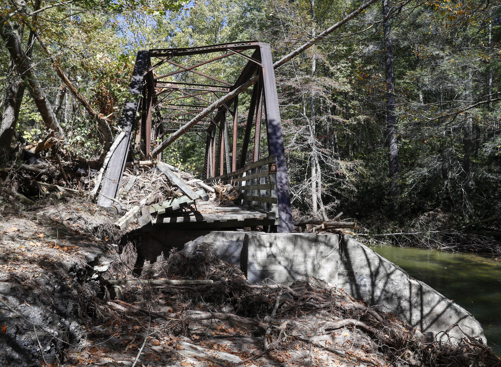 Floodwaters destroyed 18 trestles on the Creeper Trail and washed away much of the path. Now ...